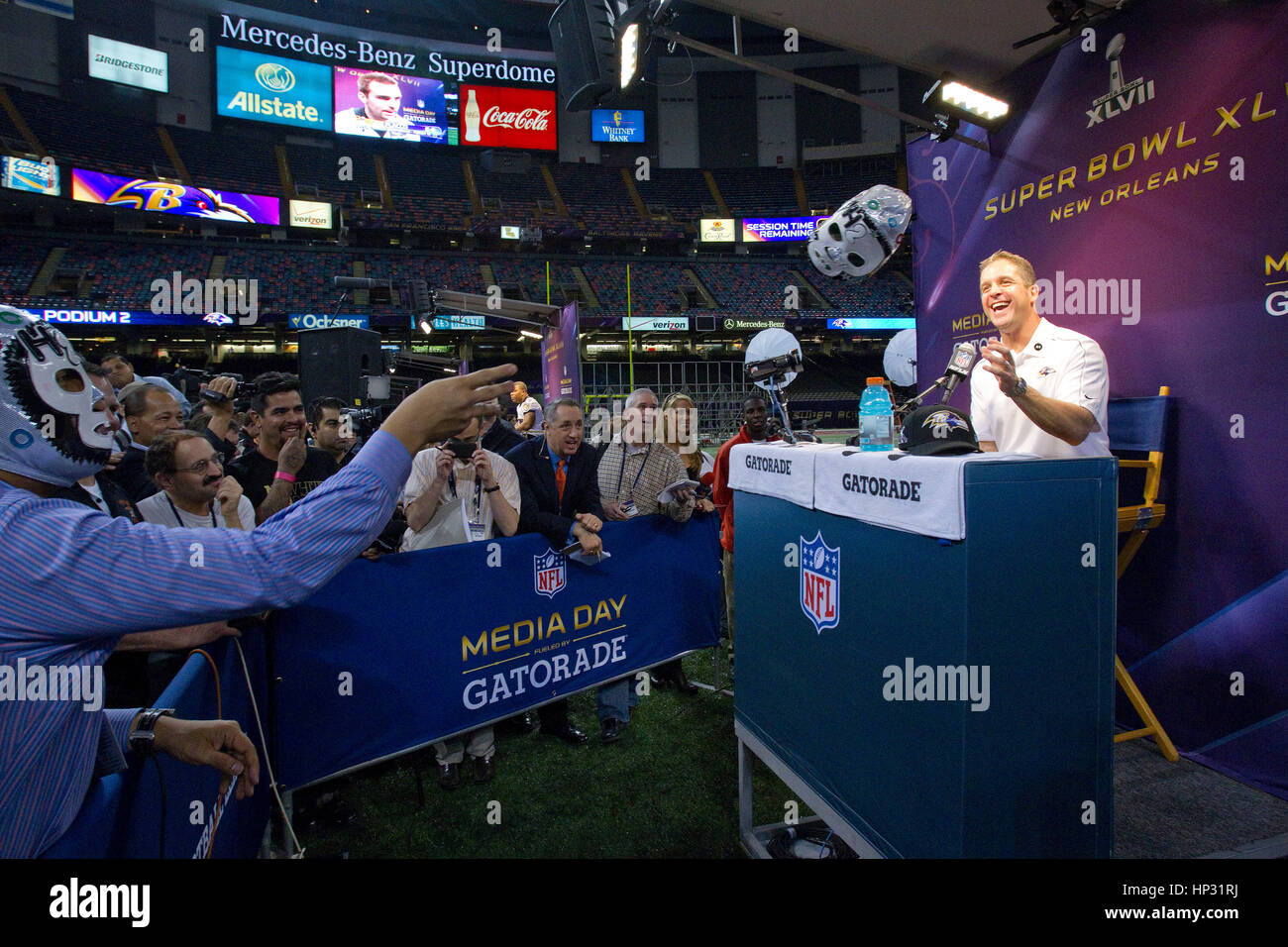 Baltimore Ravens head coach John Harbaugh, right, gets a Mexican ...