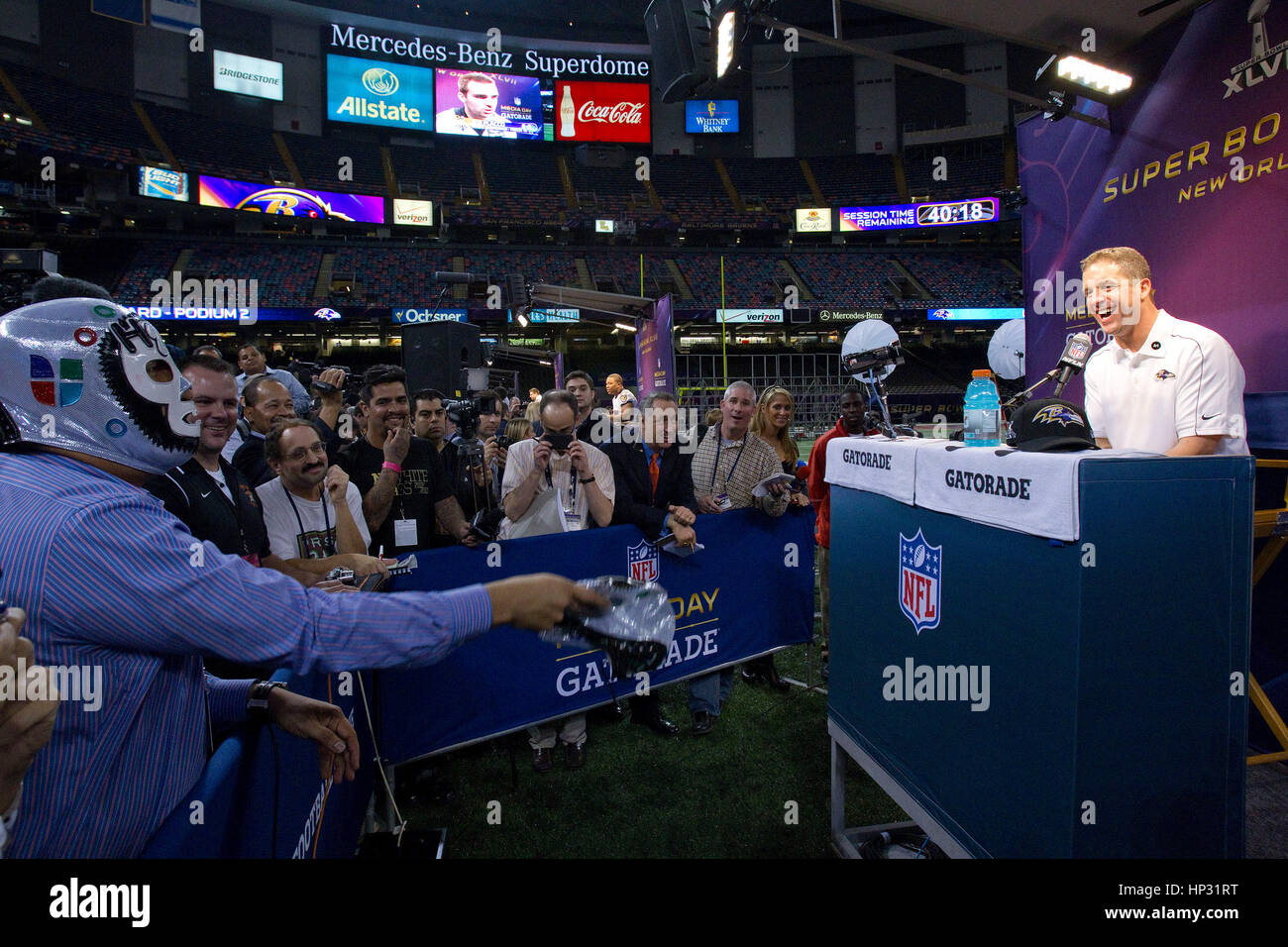 Baltimore Ravens head coach John Harbaugh, right, gets a Mexican ...