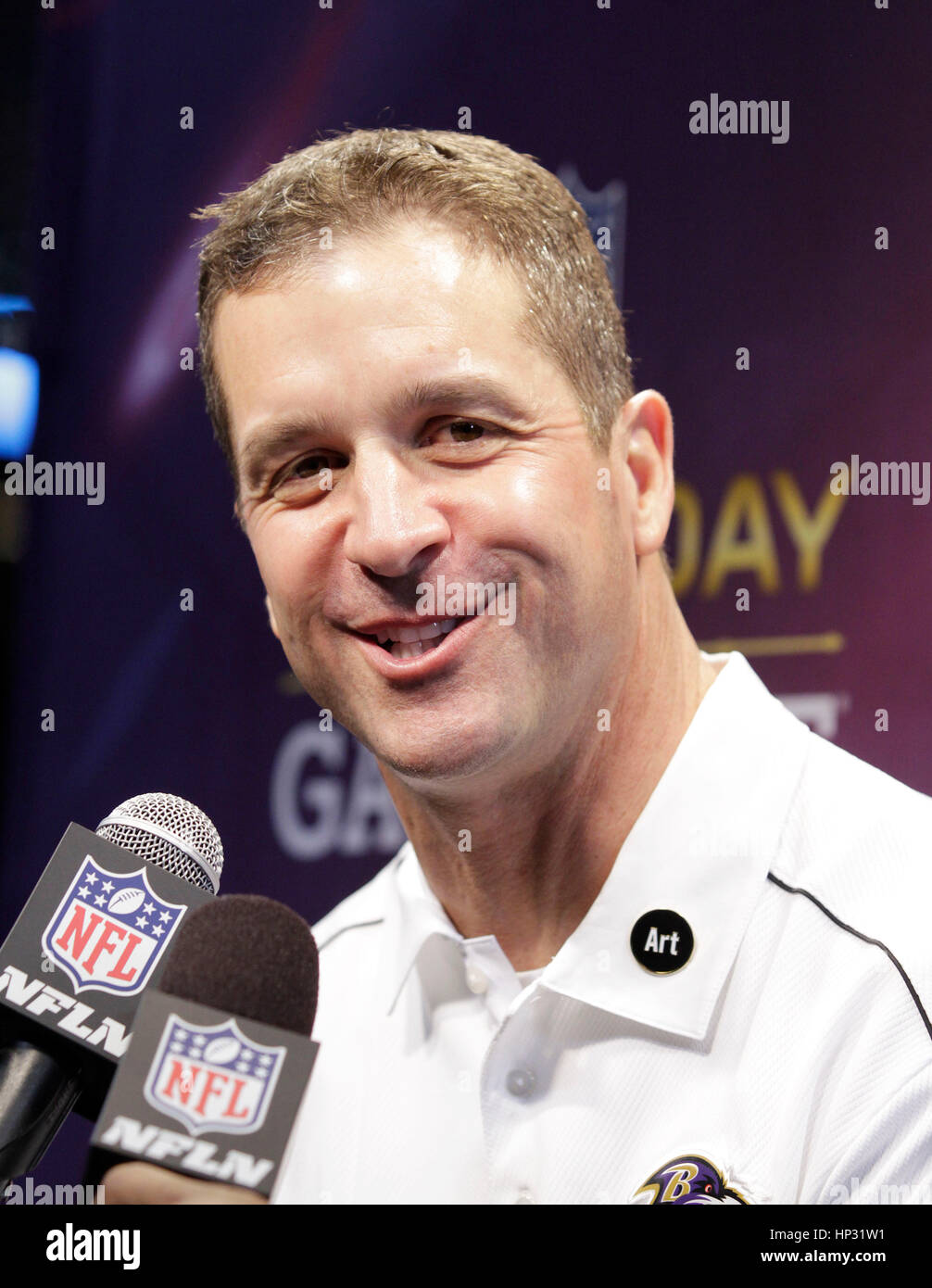 Baltimore Ravens head coach John Harbaugh talks to reporters at the ...