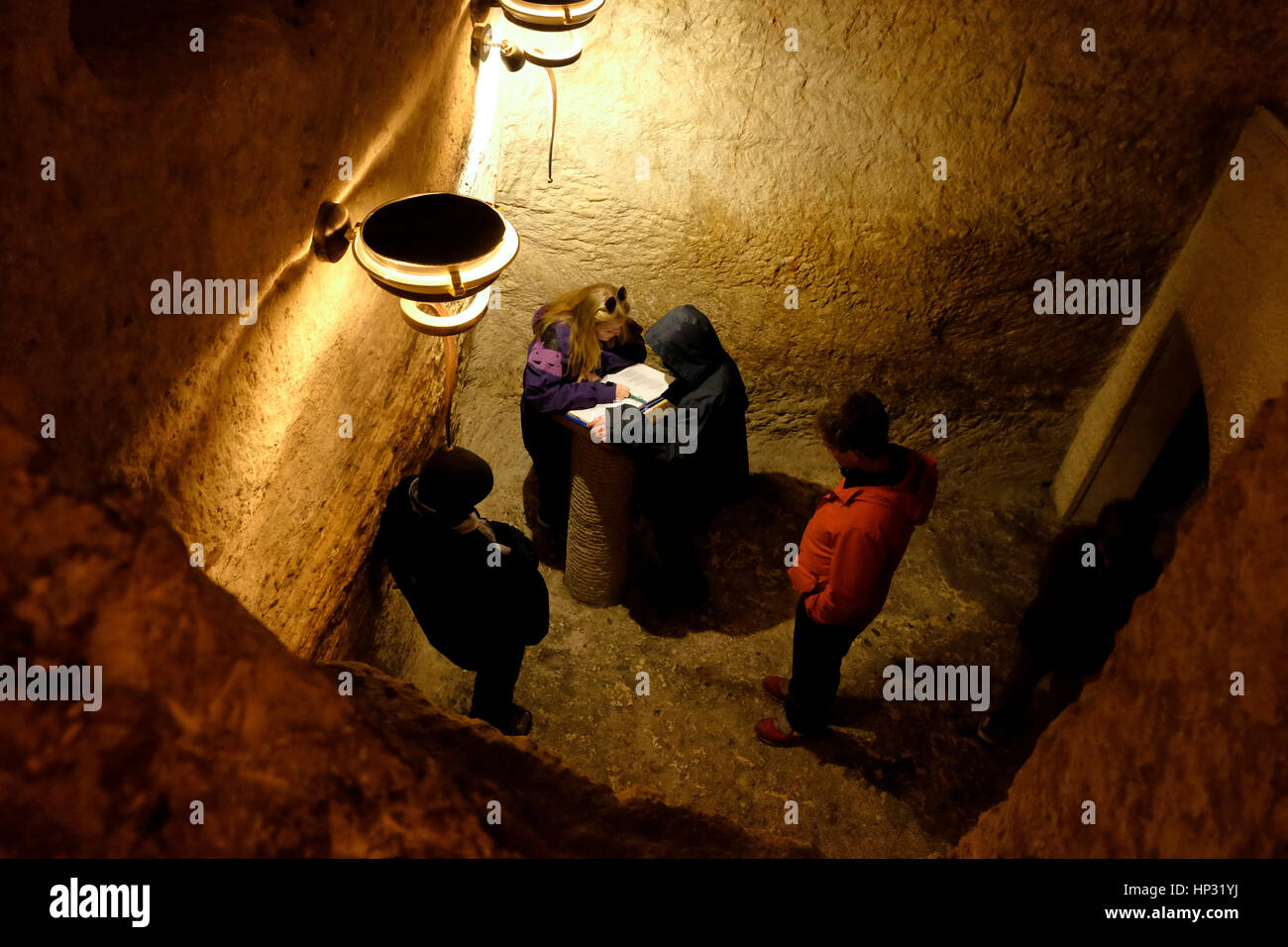 Pilgrims praying inside the Sacred Pit an ancient underground cave ...
