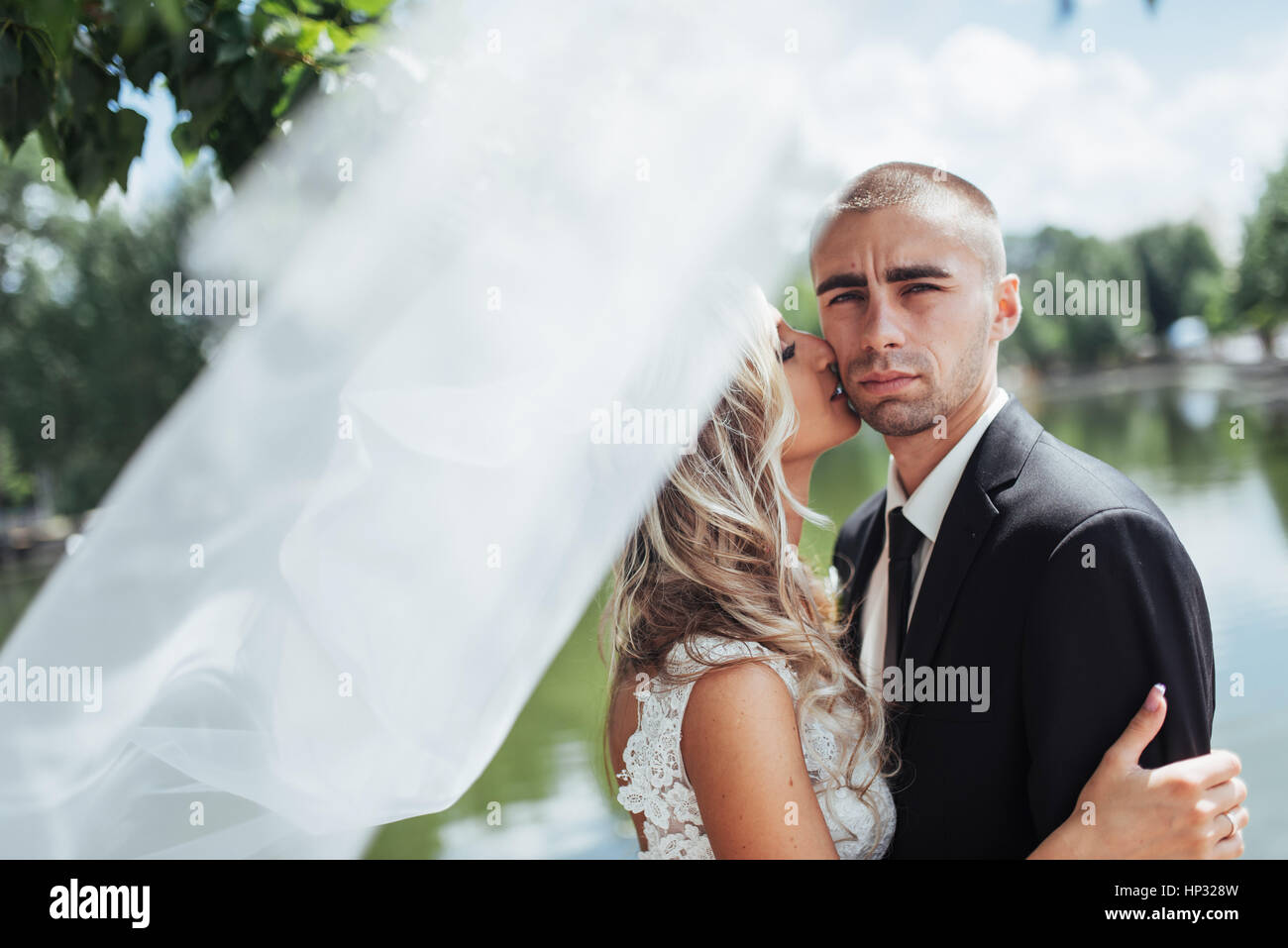 Happy young couple poses for photographers on her happiest day Stock ...
