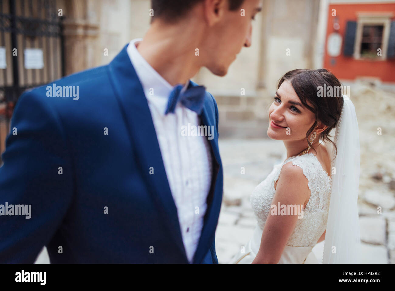 Wedding portrait of a happy couple. Stand and kissing Stock Photo - Alamy