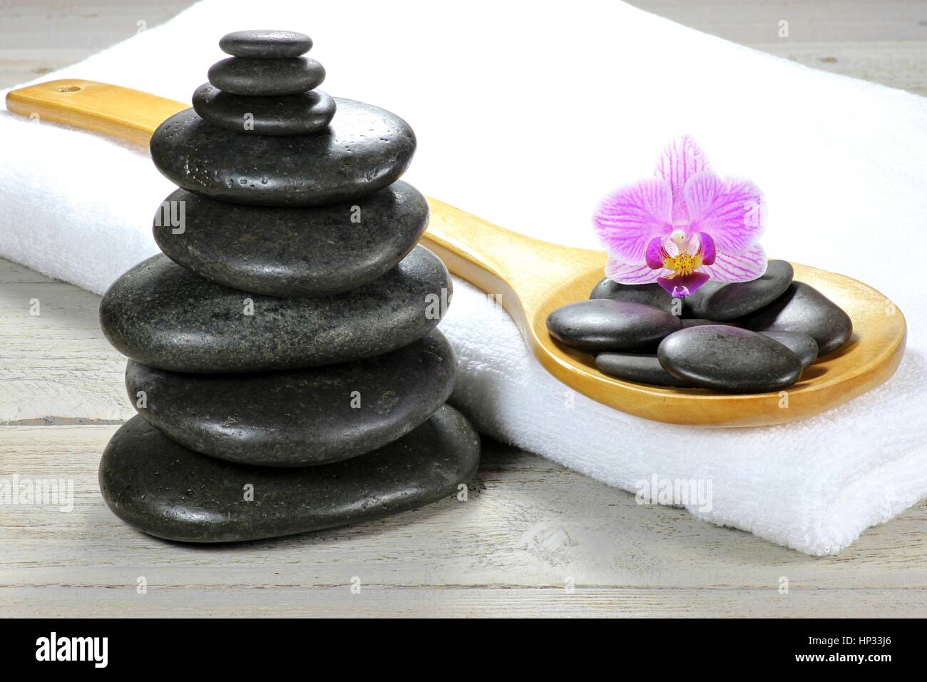 basalt stones for hot stone massage with accessories on wooden ...