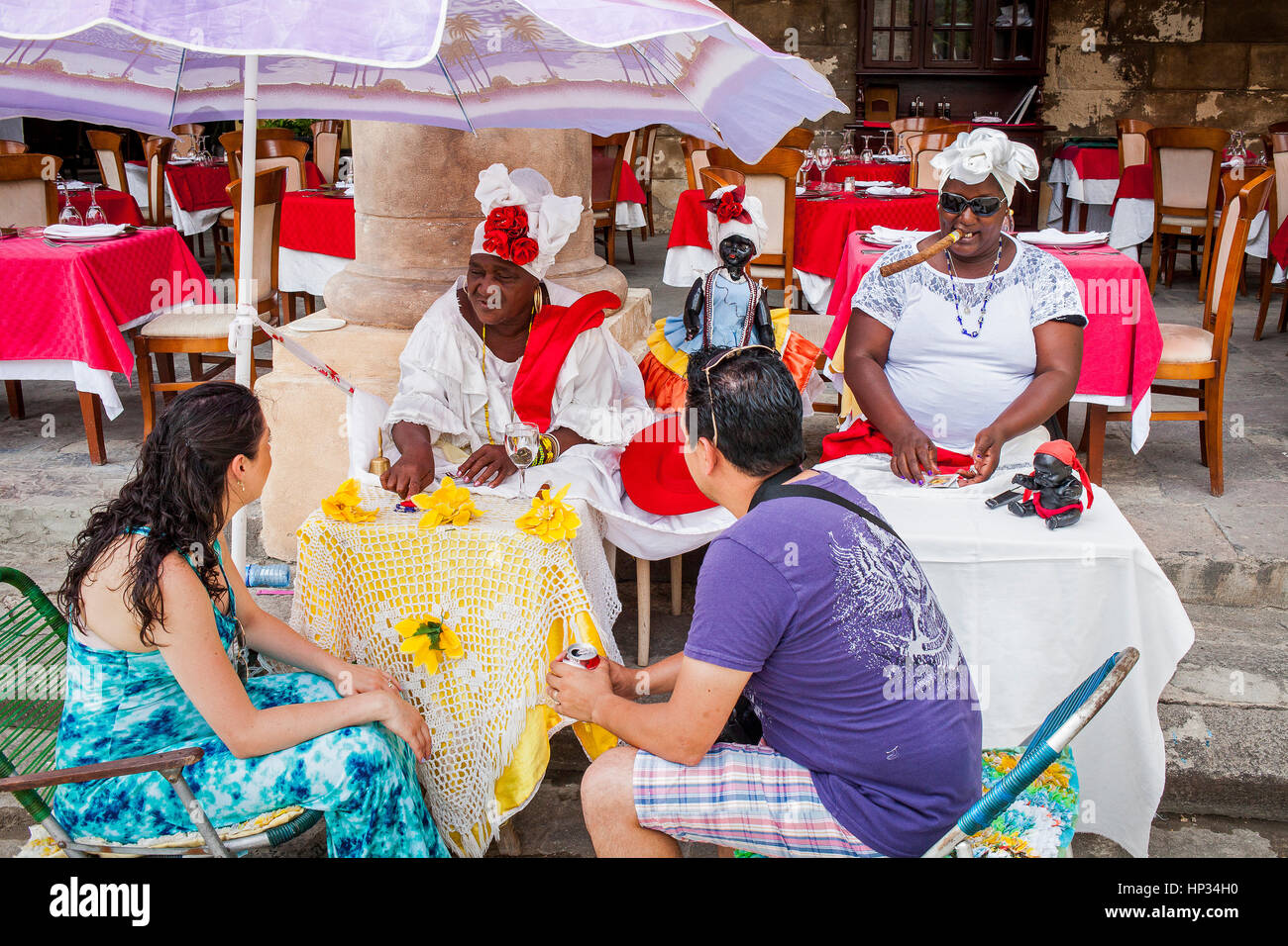 Cuban priestesses, Shaman, Afro-Cuban Santeria religion telling the ...
