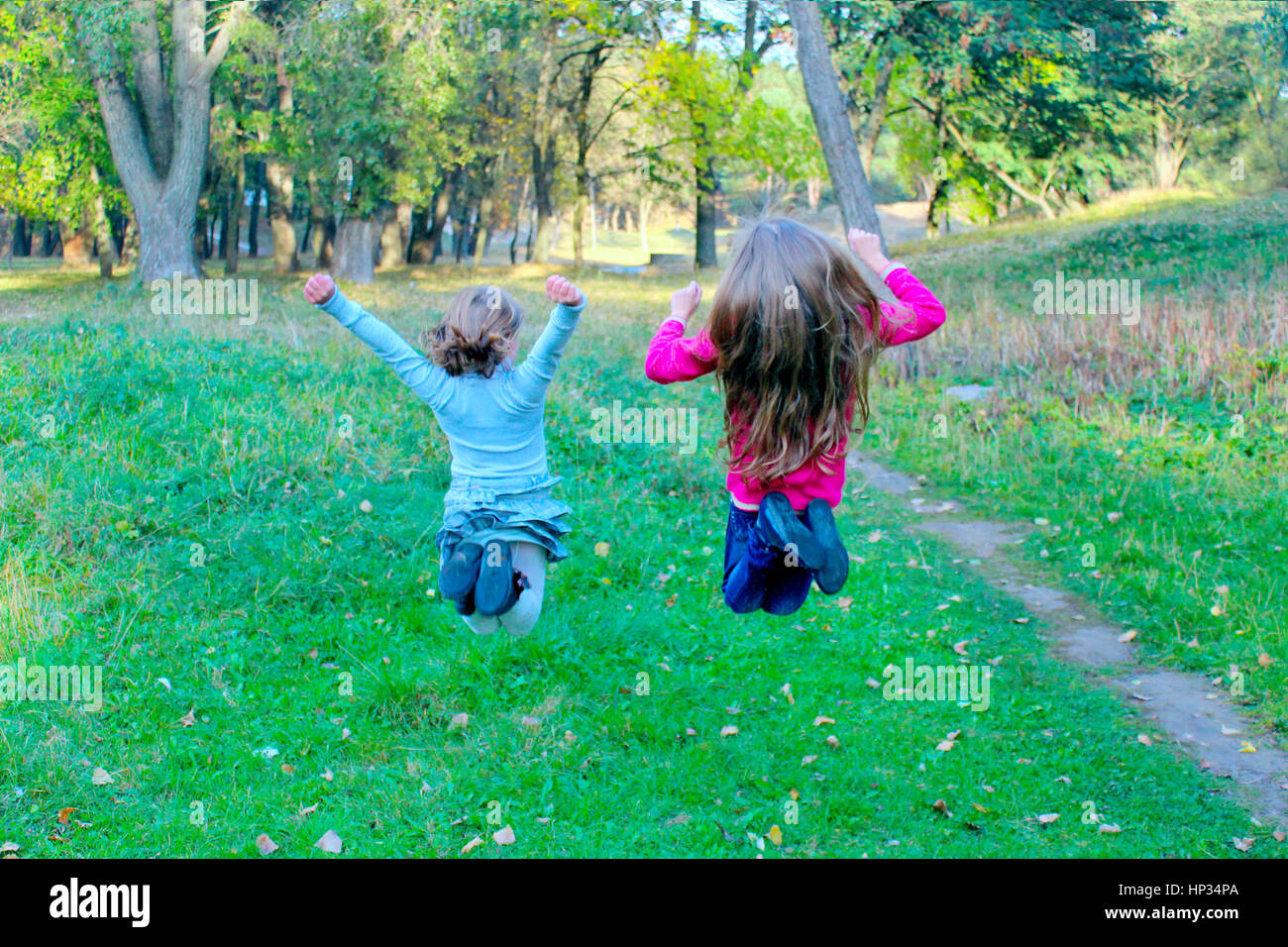 two little girls jumped up and standed motionless in the air. Wow ...