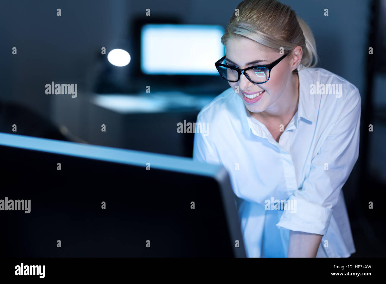 Charismatic young office manager using gadgets at work Stock Photo - Alamy