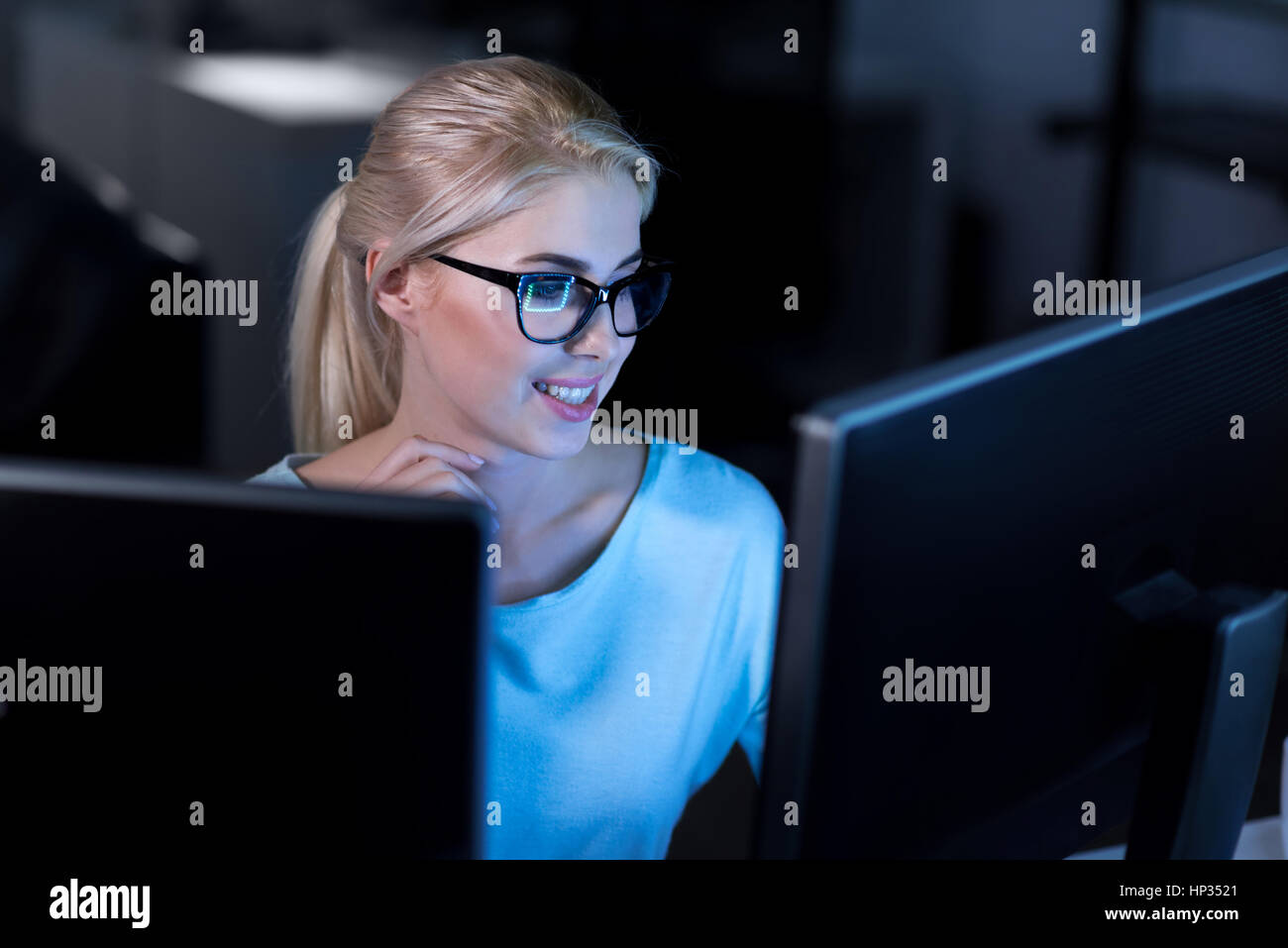 Happy female programmer working in the office Stock Photo - Alamy