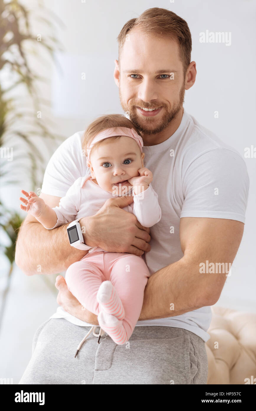 Sweet child expressing emotions with the father Stock Photo - Alamy