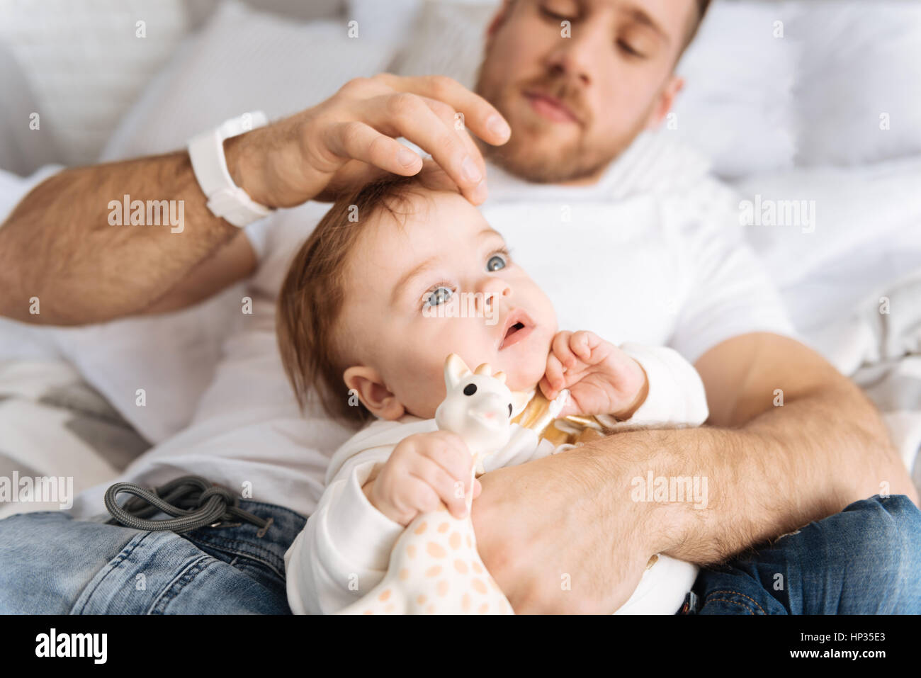 Young father expressing care to his daughter at home Stock Photo - Alamy