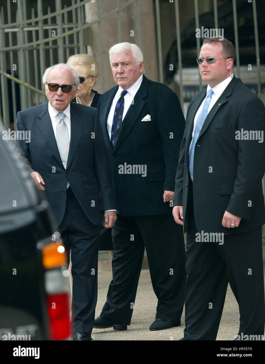 Merv Griffin, center, leaves the funeral service for President Ronald ...