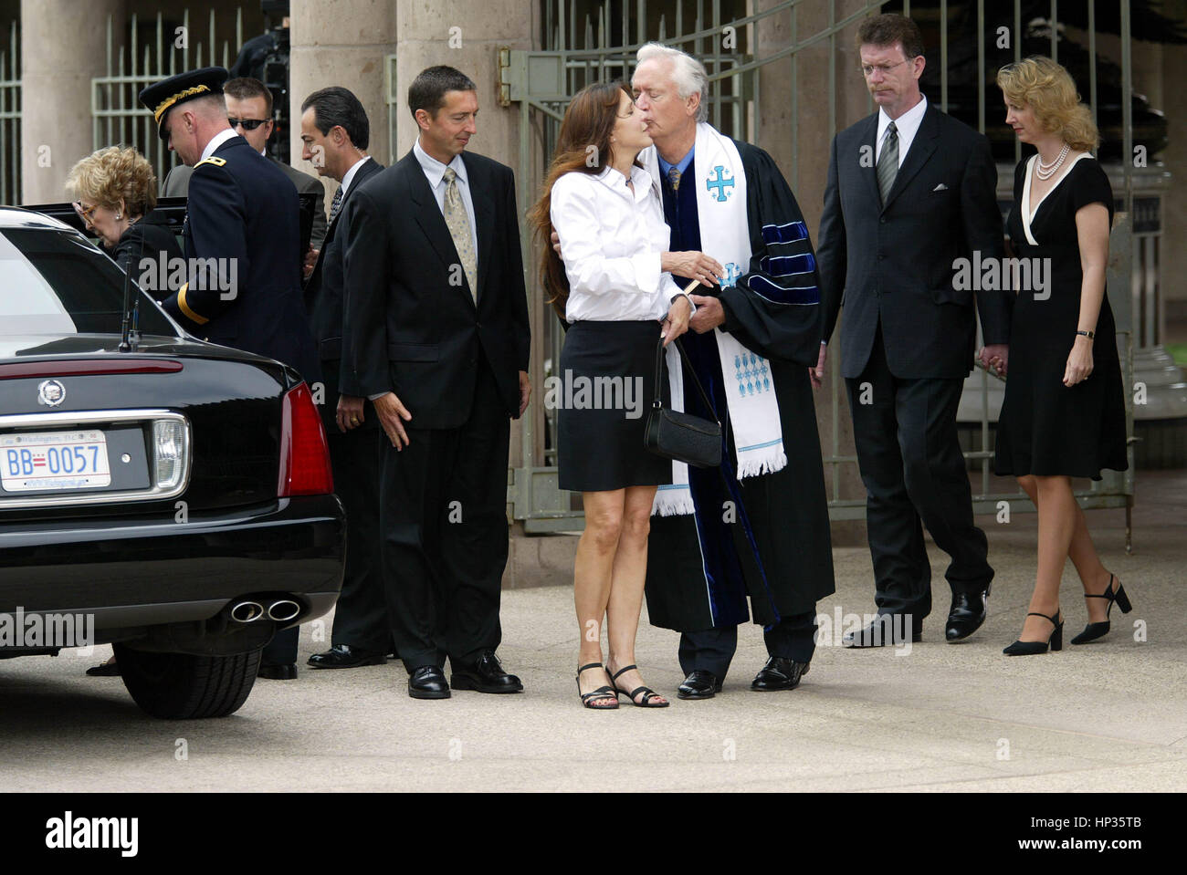 Rev. Michael Wenning, right, consoles Patti Davis, daughter of former ...