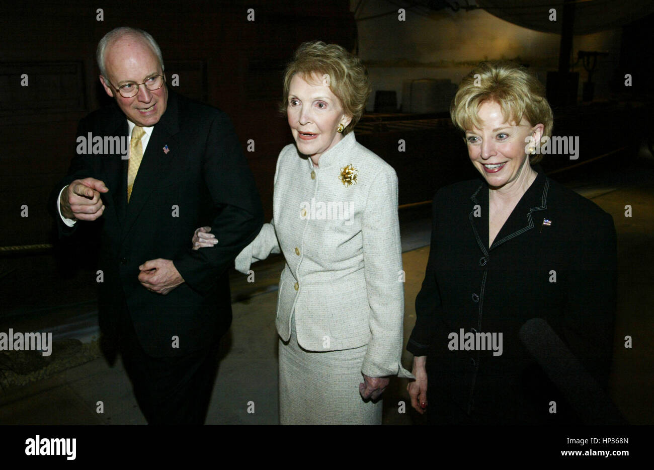 Vice President Dick Cheney, (L) , escorts Nancy Reagan, (C) and his ...