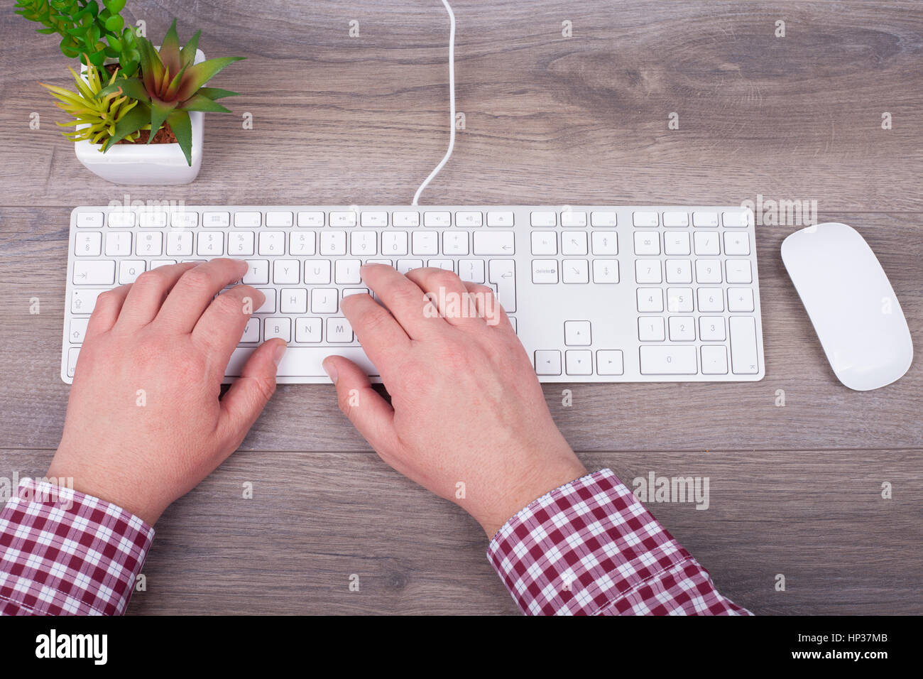 Close-up of typing male hands on keyboard from above Stock Photo - Alamy