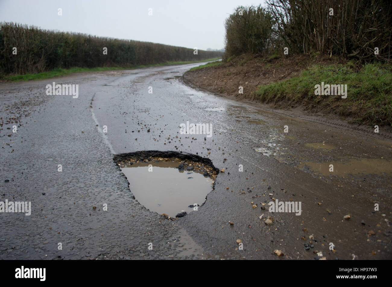 Potholes on a public road in the UK Stock Photo - Alamy