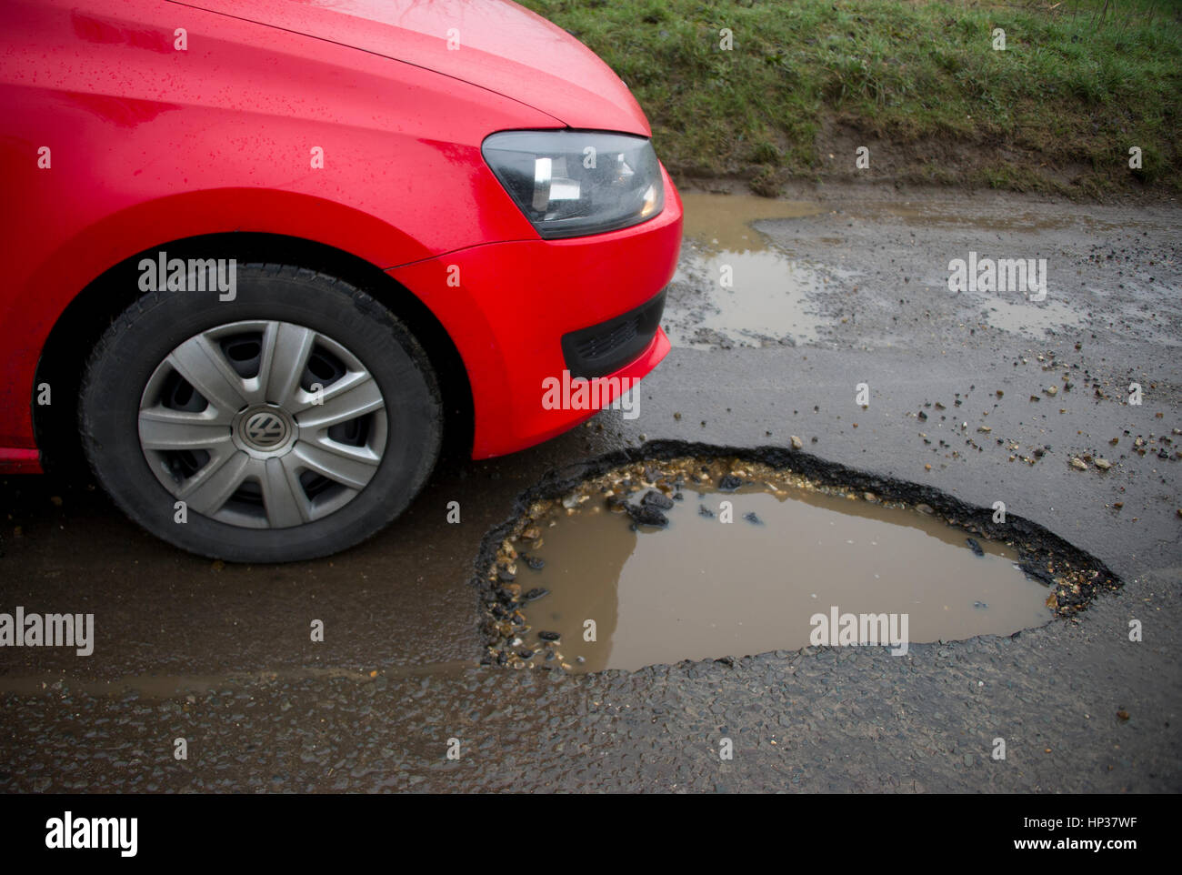 Potholes on a public road in the UK Stock Photo - Alamy