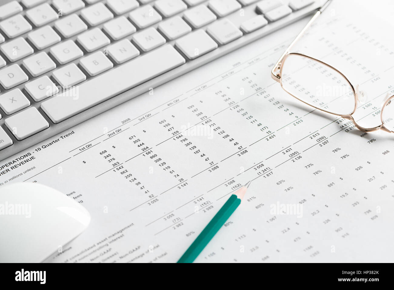 Business workplace with keyboard mouse and papers with graphs and ...