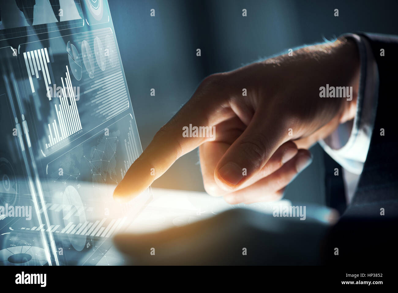 Businessman hand touching with finger virtual panel with infographs ...