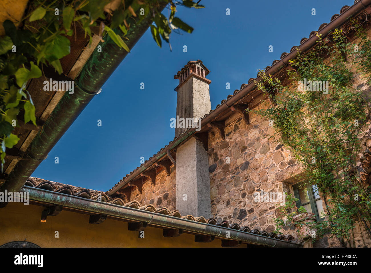 Fieldstone building with chimney Stock Photo - Alamy