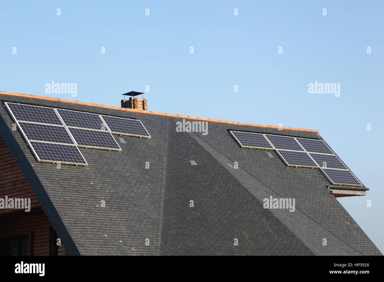 Solar panels on a roof Stock Photo - Alamy