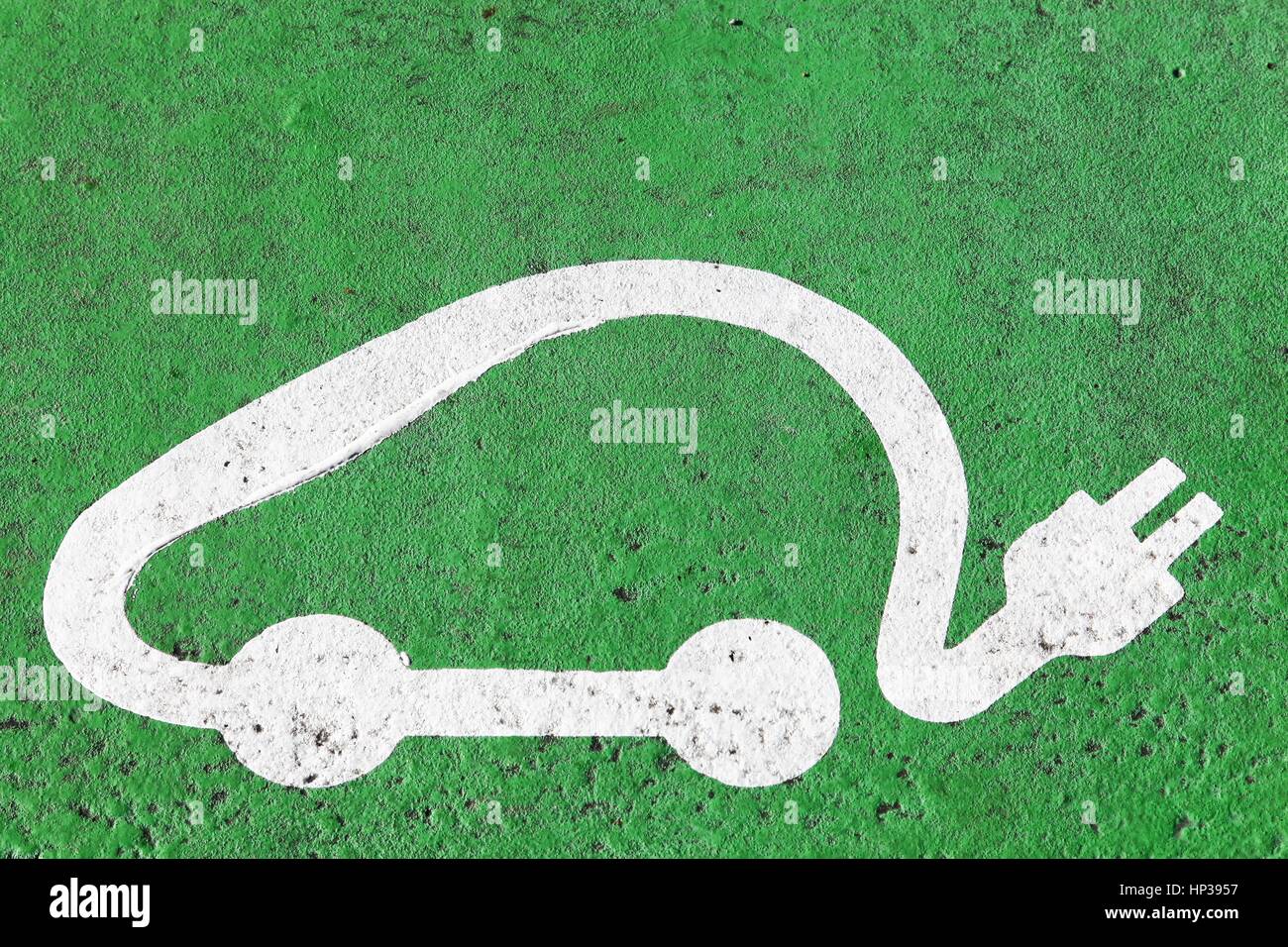 Electric car charging symbol on a parking Stock Photo - Alamy