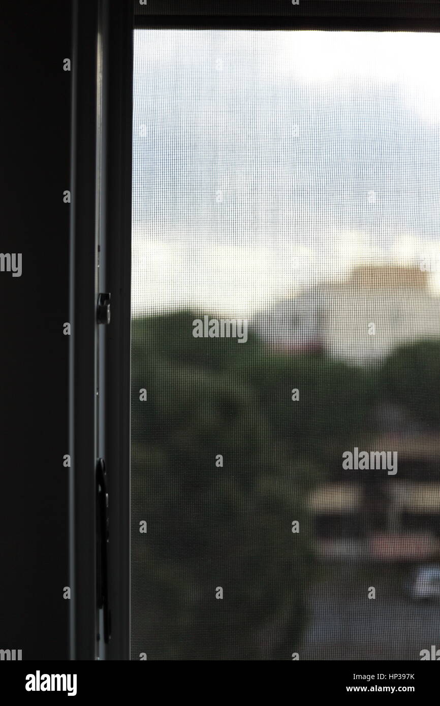 Mosquito net on a PVC window Stock Photo - Alamy