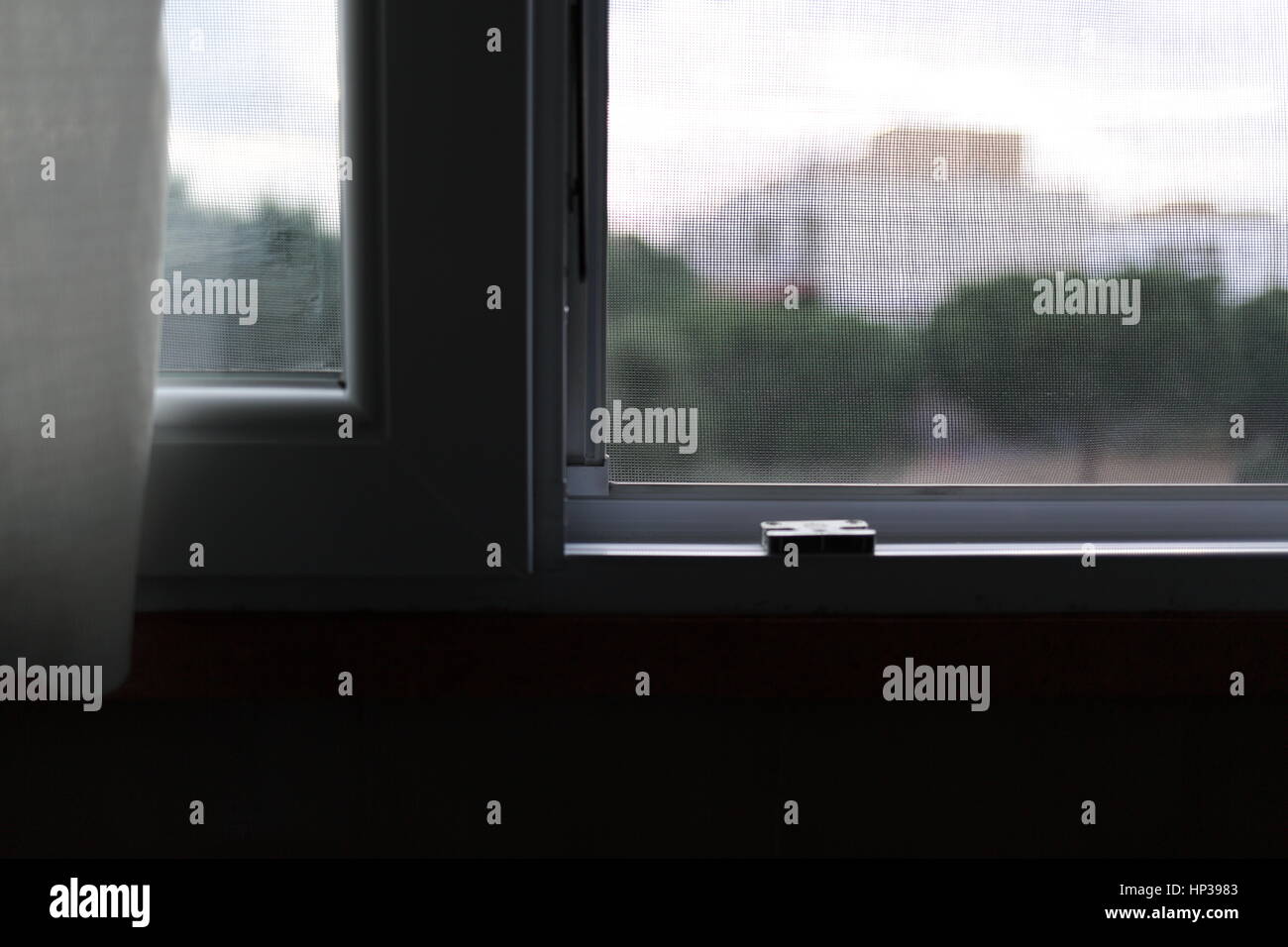 Mosquito net on a PVC window Stock Photo - Alamy
