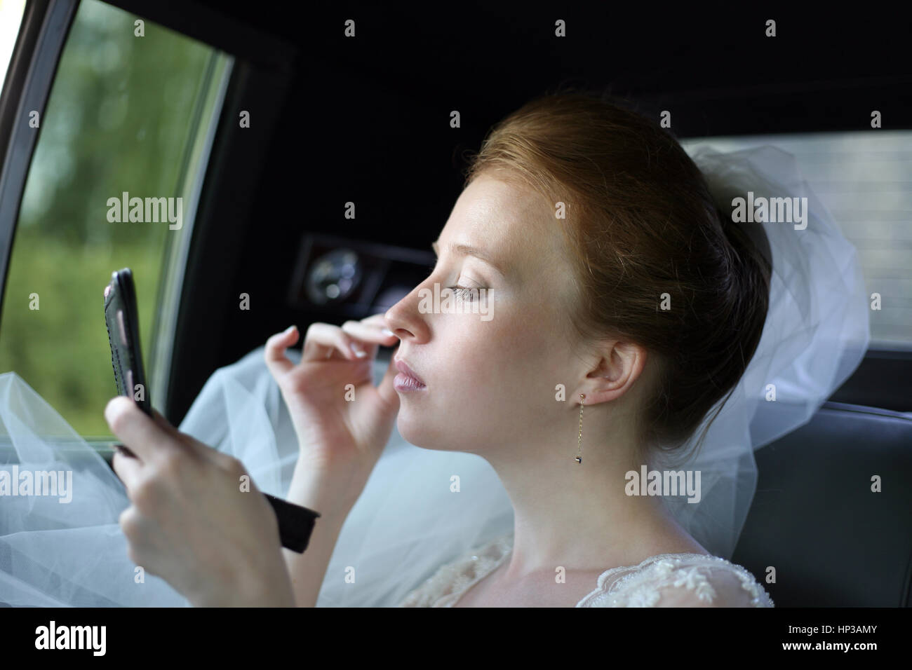 The beautiful bride in the automobile Stock Photo - Alamy