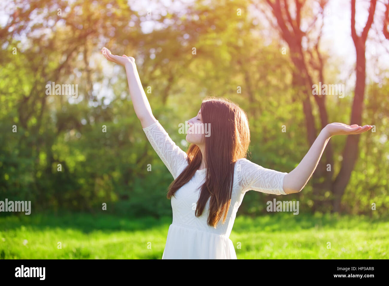 beautiful girl enjoying the spring sun Stock Photo - Alamy