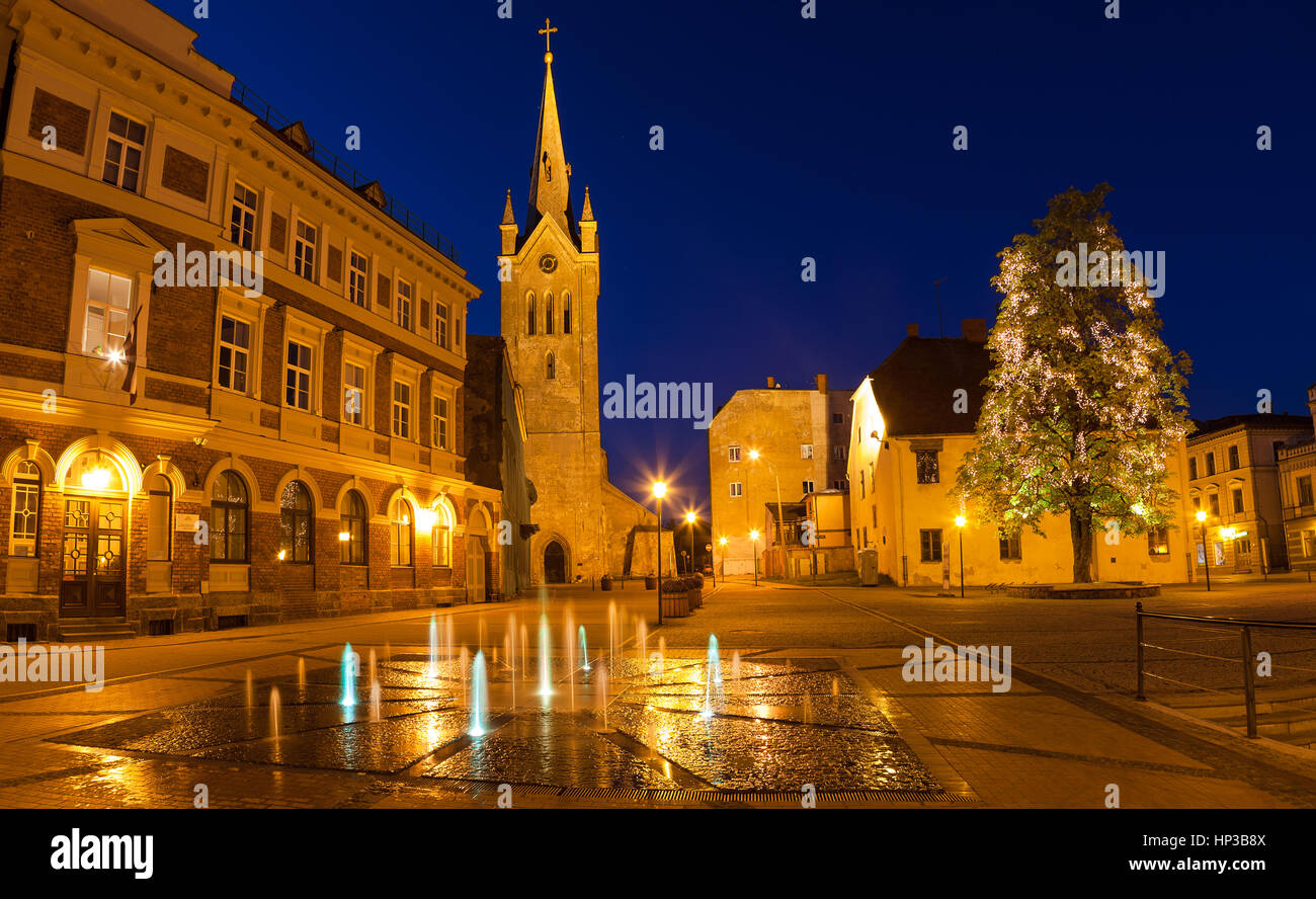 Medieval church of Saint John and night old town view of Cesis, Latvia ...