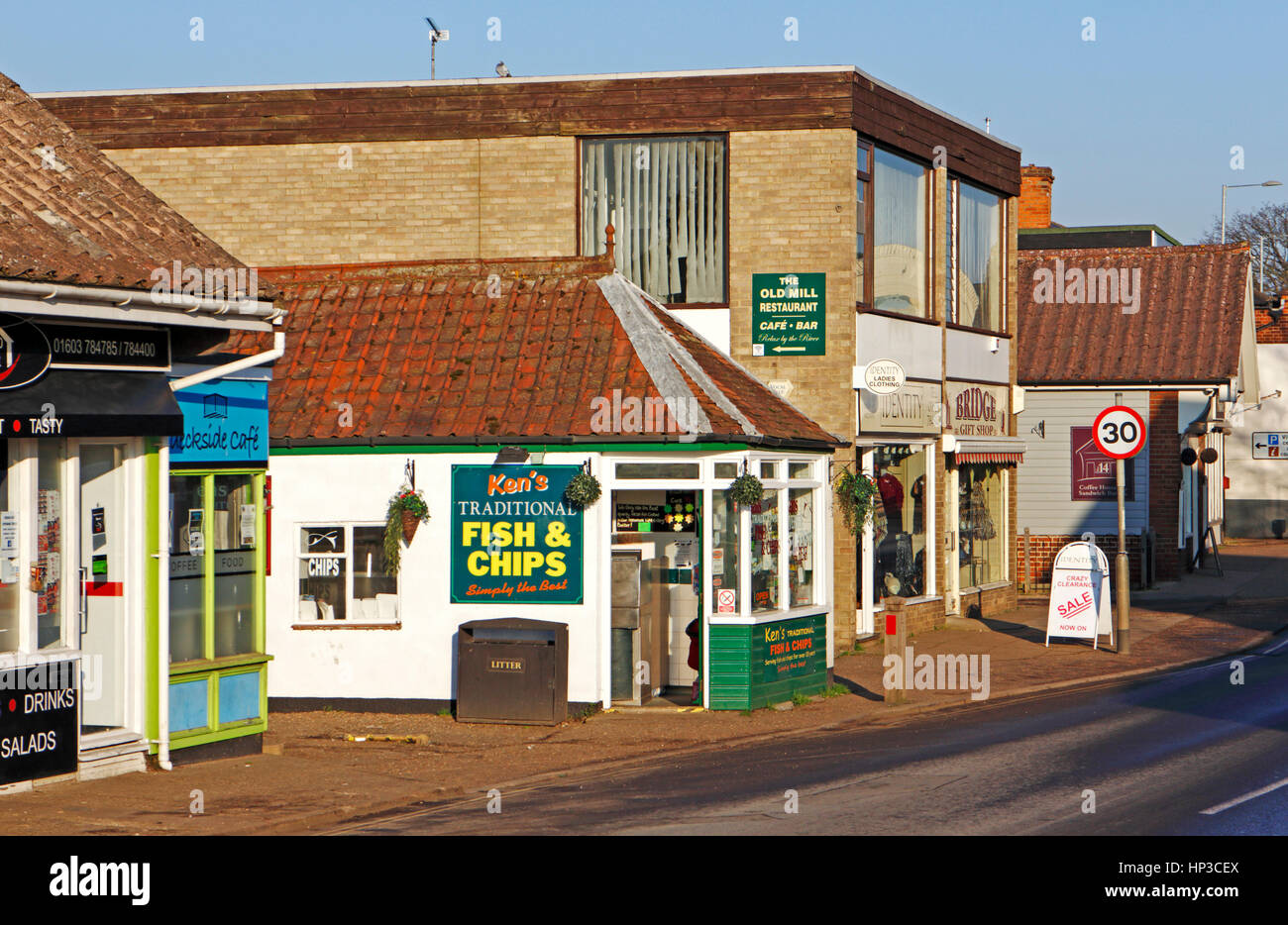 A view of shops by Wroxham Bridge on the Norfolk Broads at Hoveton ...