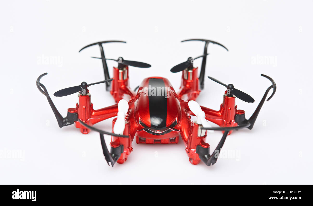 One red toy drone isolated on white background. Close up of drone front ...