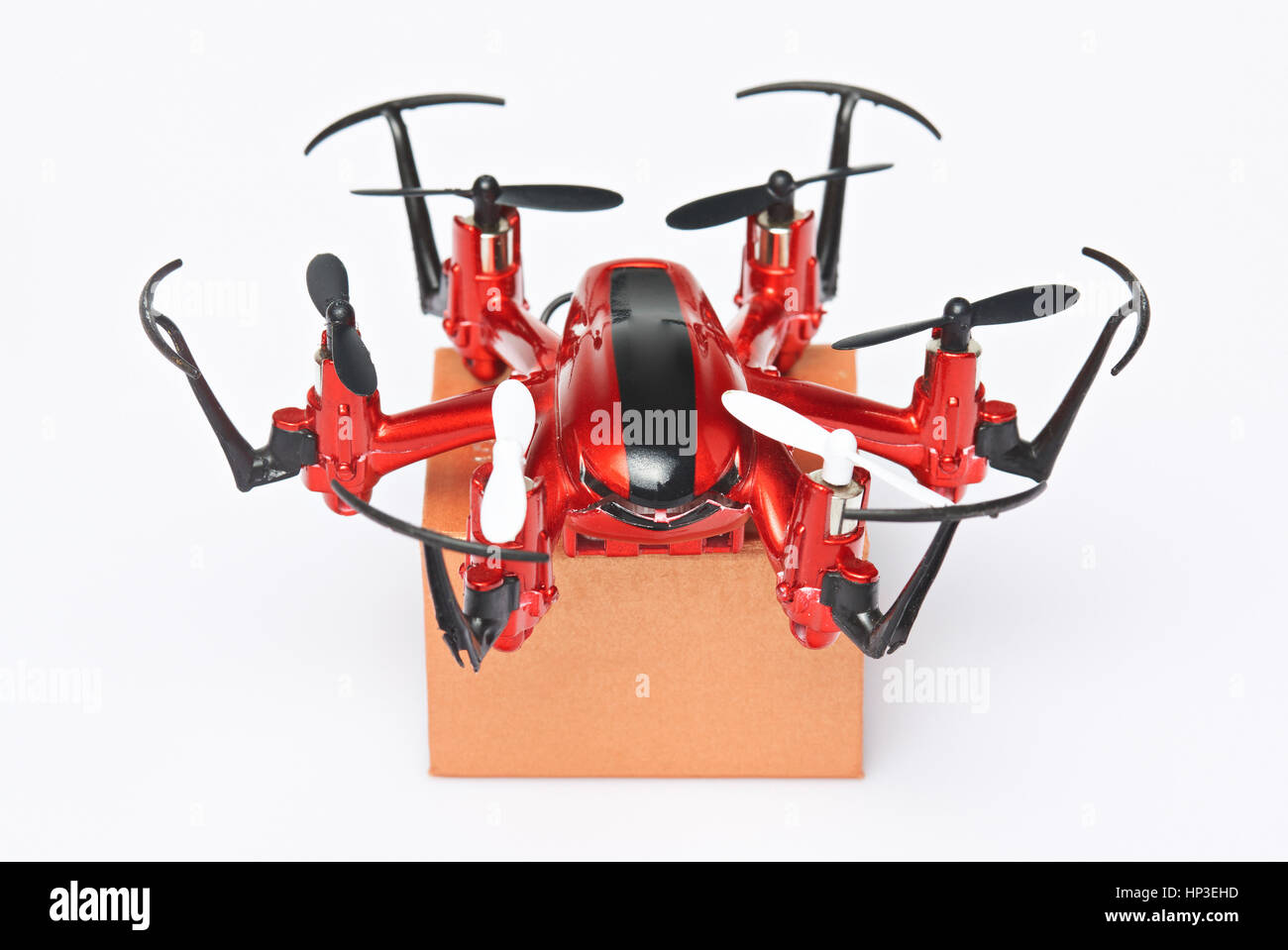 Closeup of drone with package box isolated on white background ...