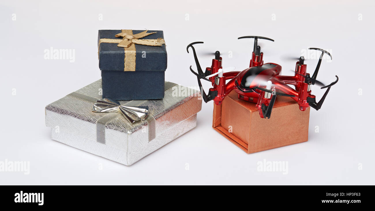Future delivery via air drones isolated on white background. Gift box ...