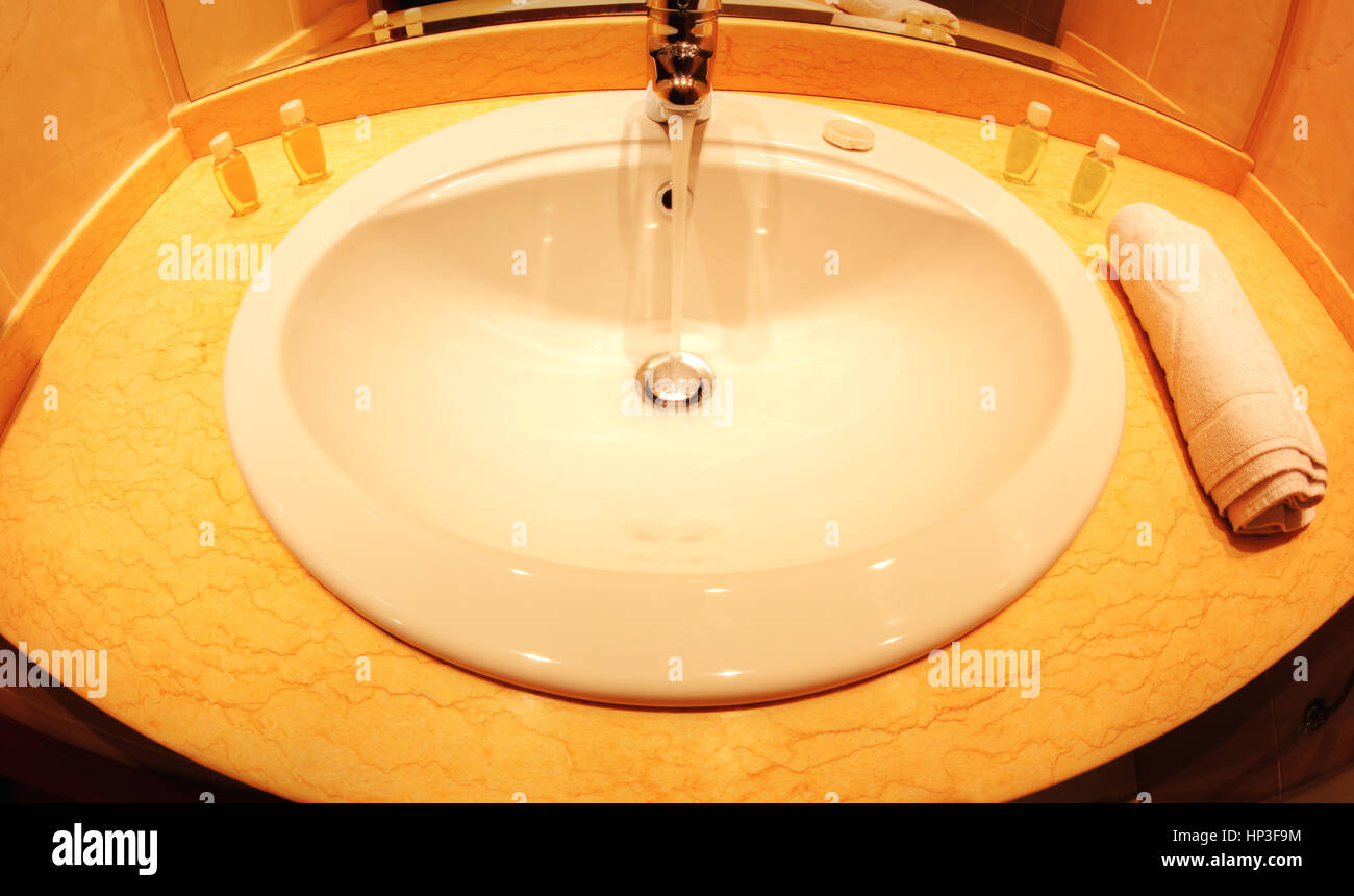 Wash sink in a bathroom in fish-eye perspective Stock Photo - Alamy