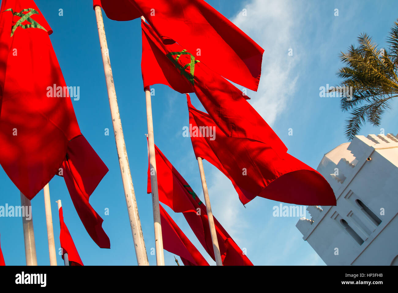 Moroccan flags in Marrakech on a background of blue sky wide shot Stock ...