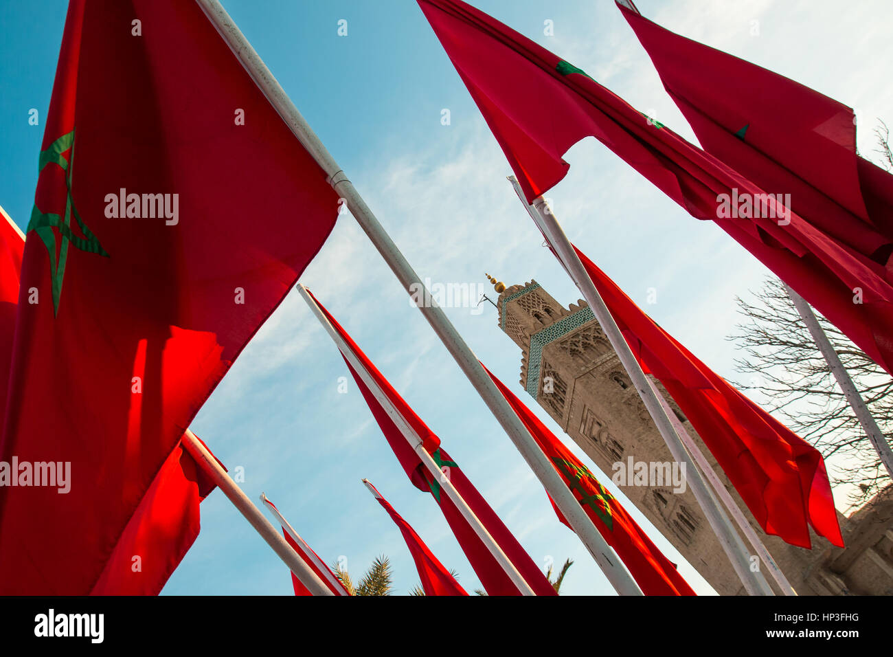 Moroccan flags in Marrakech on a background of blue sky Stock Photo - Alamy