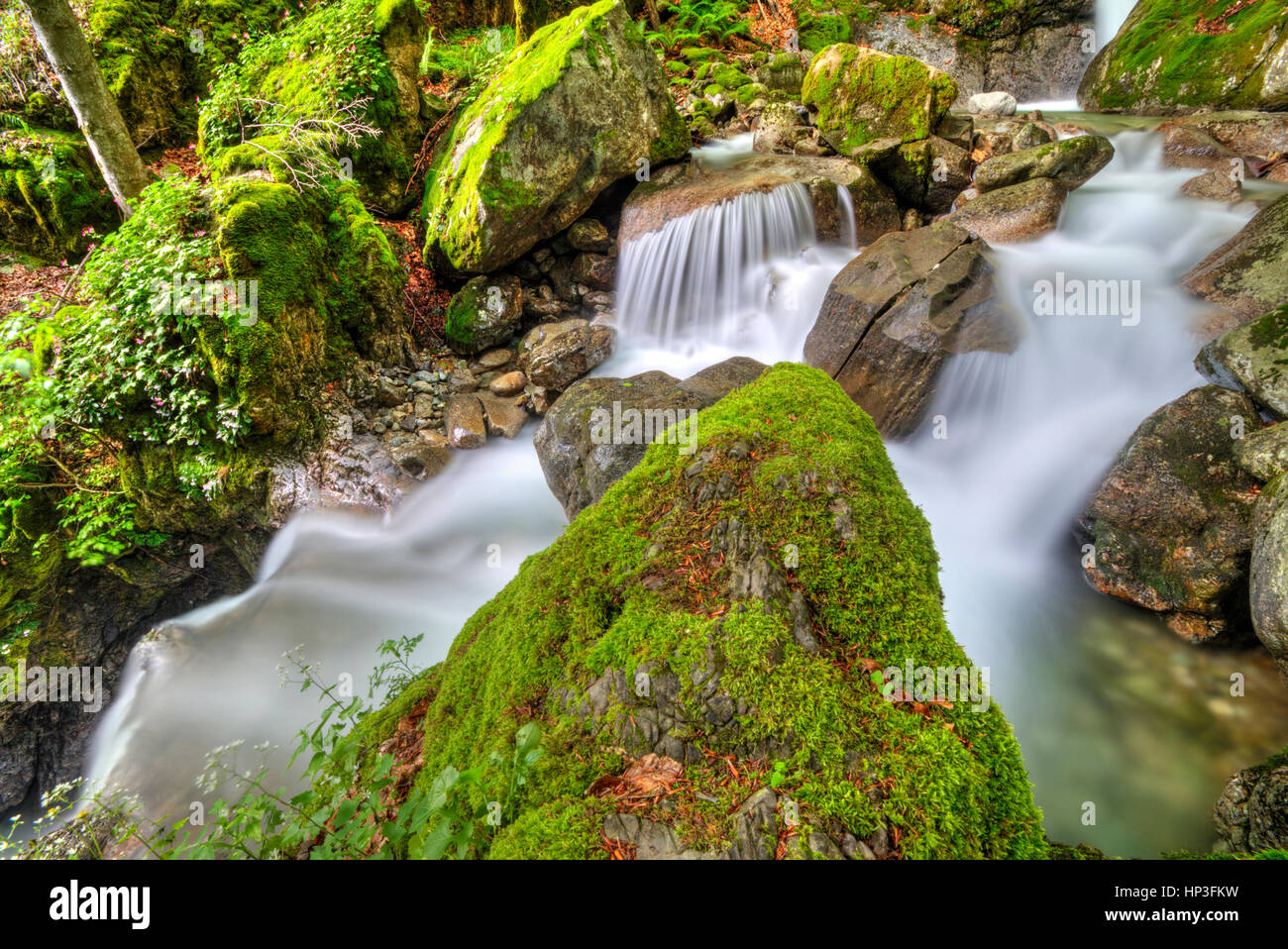 Beautiful mountain landscape with waterfall Stock Photo - Alamy