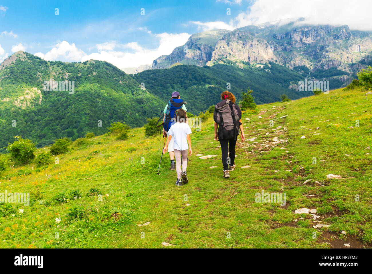 Family tourists in the mountain Stock Photo - Alamy