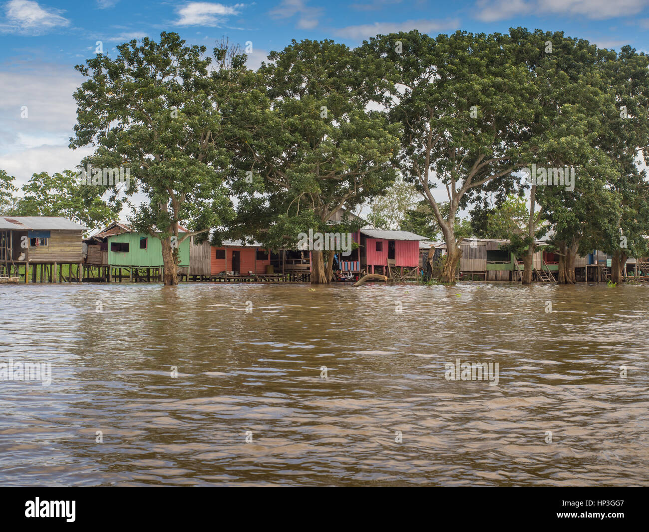 Amazon River, Peru - May 11, 2016: Small village on the bank of the ...