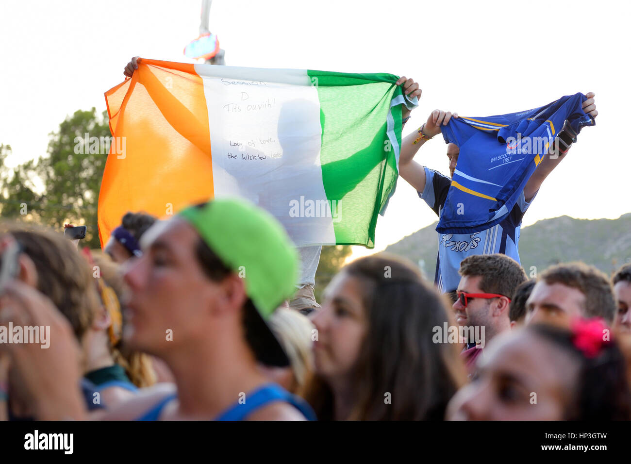 BENICASSIM, SPAIN - JULY 20: Young man from the crowd cheering, with an ...