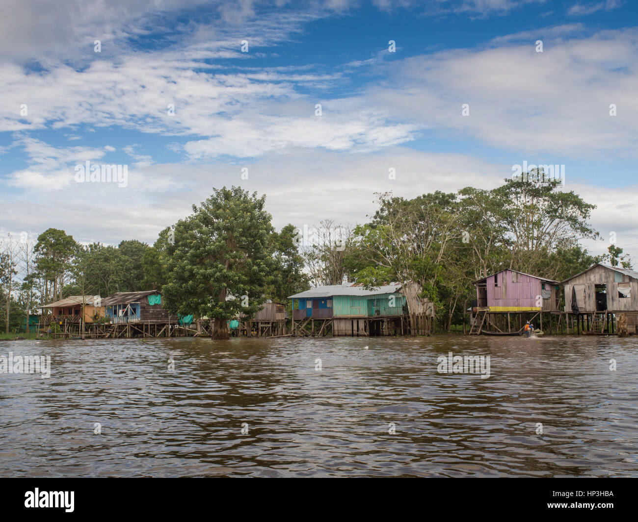Amazon River, Peru - May 11, 2016: Small village on the bank of the ...