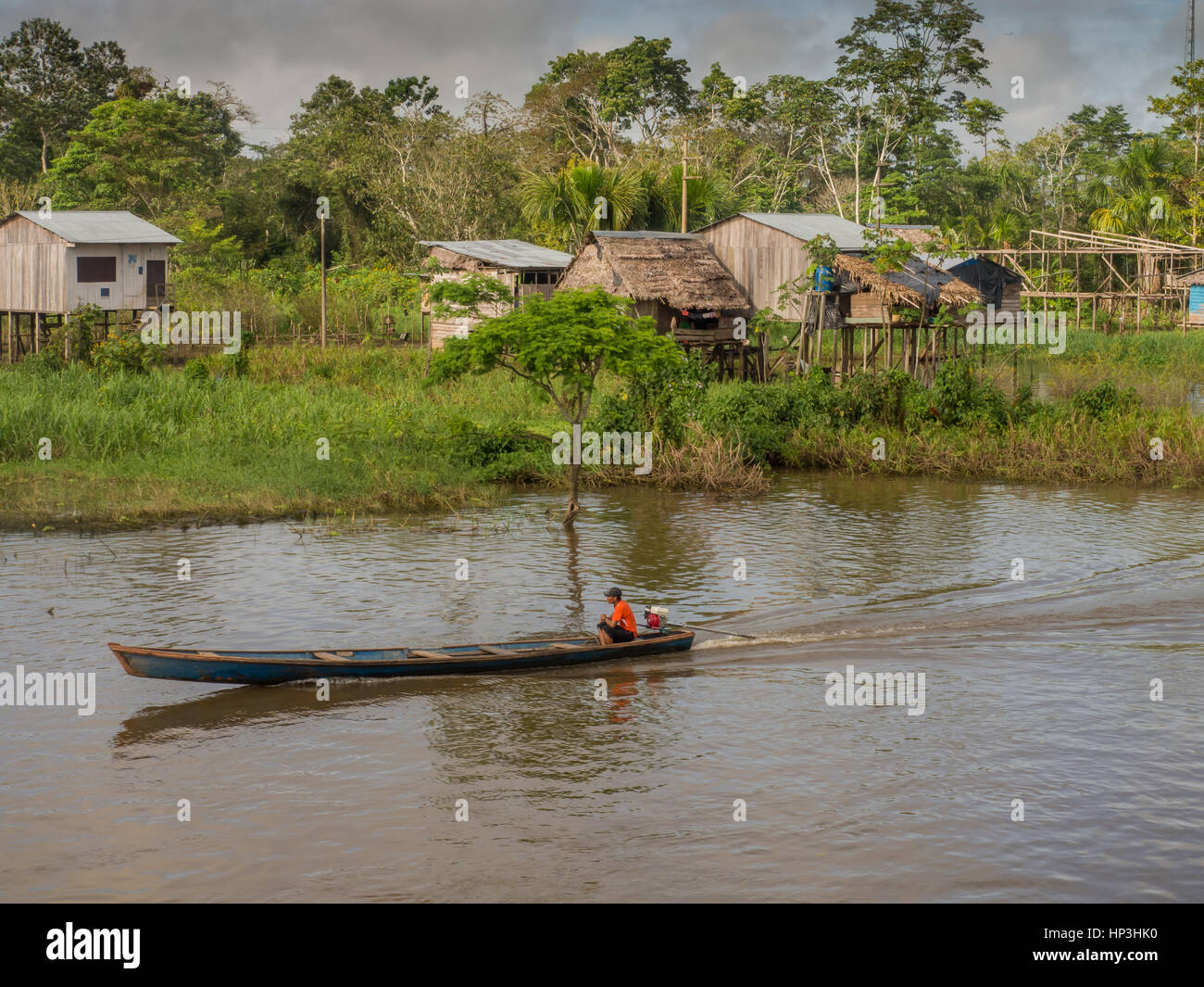 Amazon River, Peru - May 12, 2016: Small village on the bank of the ...