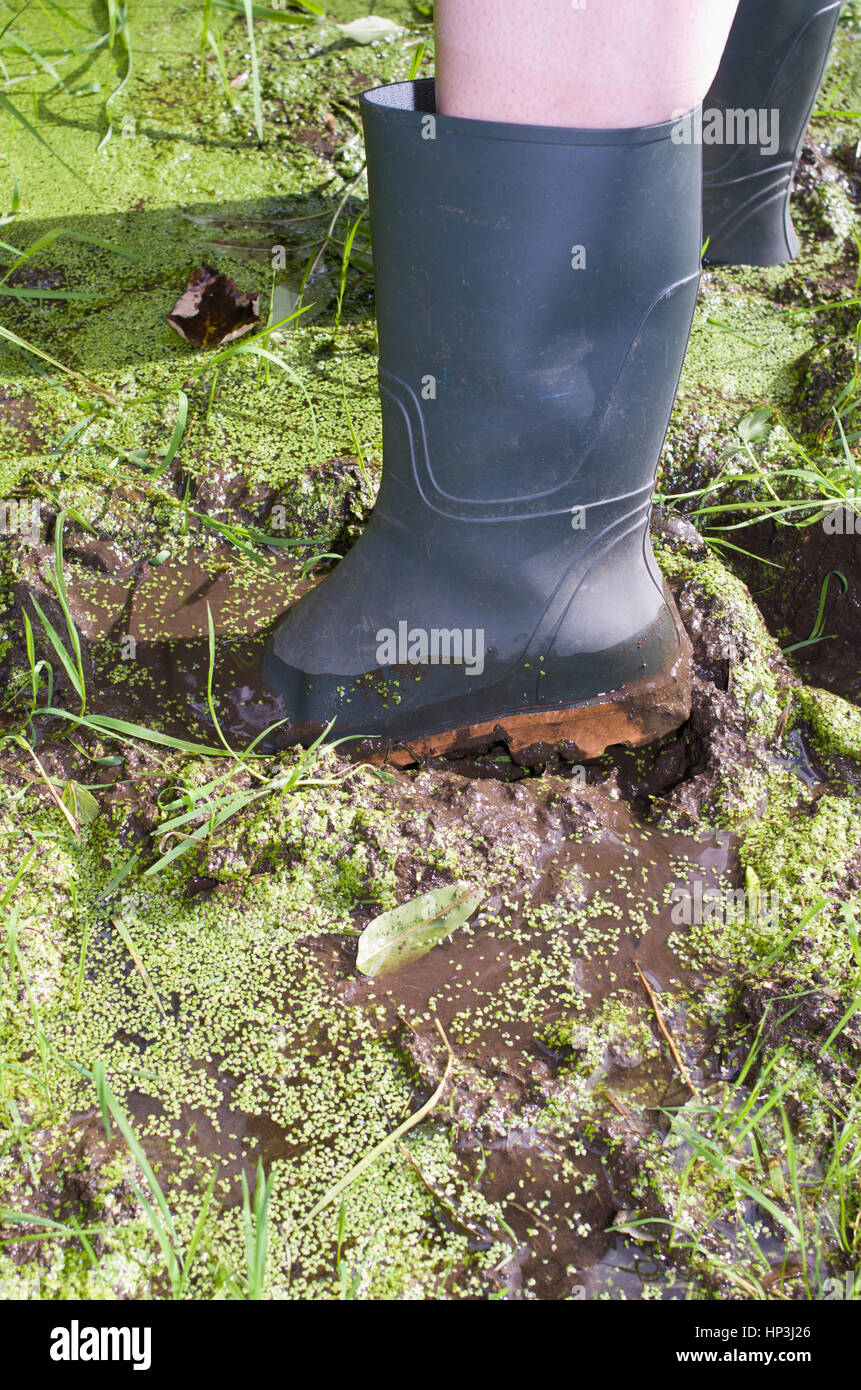 Lady wearing wellies, wet and muddy under foot Stock Photo - Alamy