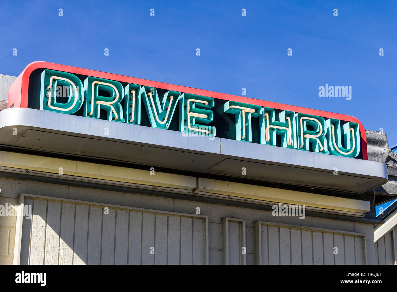 Neon Drive Thru Sign at a Fast Food Restaurant I Stock Photo - Alamy