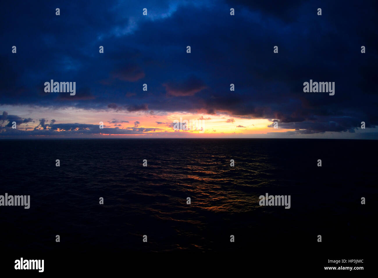 Sunset with rain clouds on the open sea, Atlantic Stock Photo - Alamy