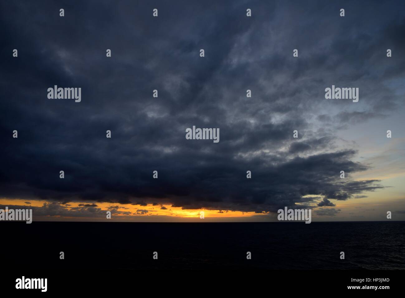 Sunset with rain clouds on the open sea, Atlantic Stock Photo - Alamy