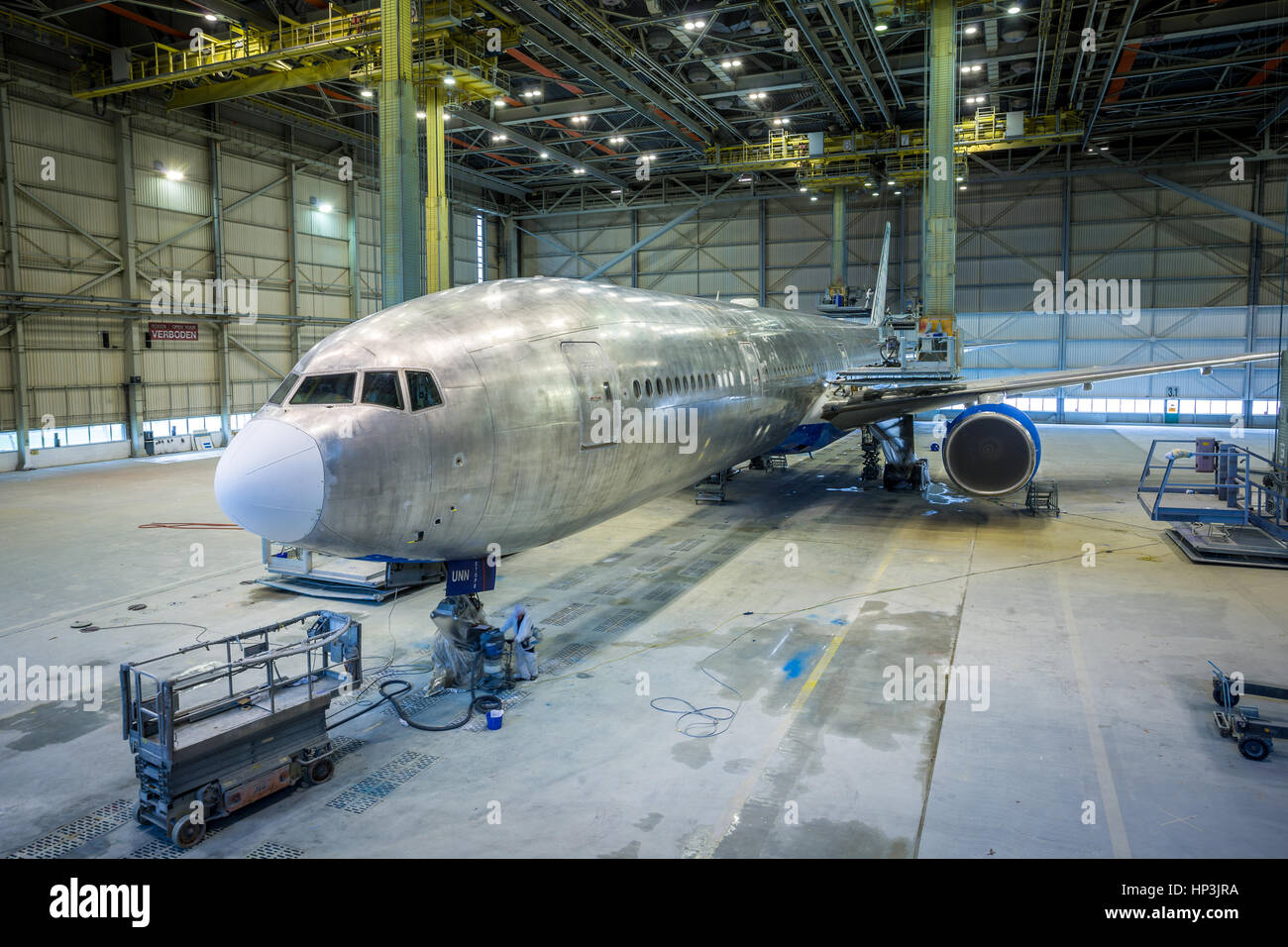 Refurbishment of an airplane, grinding and painting Stock Photo - Alamy