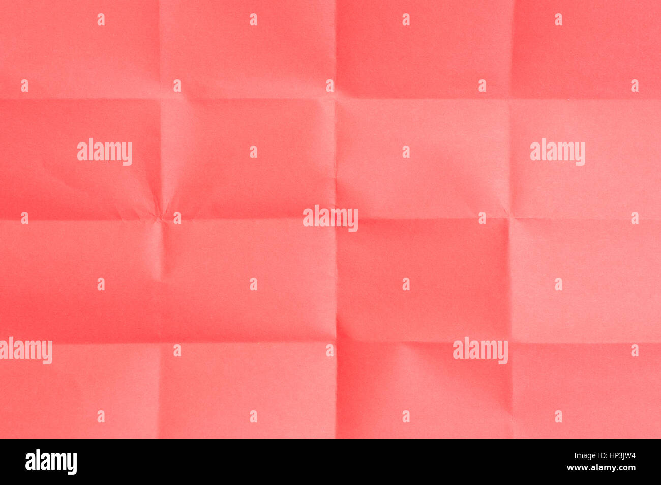 Red sheet of paper folded many times Stock Photo - Alamy