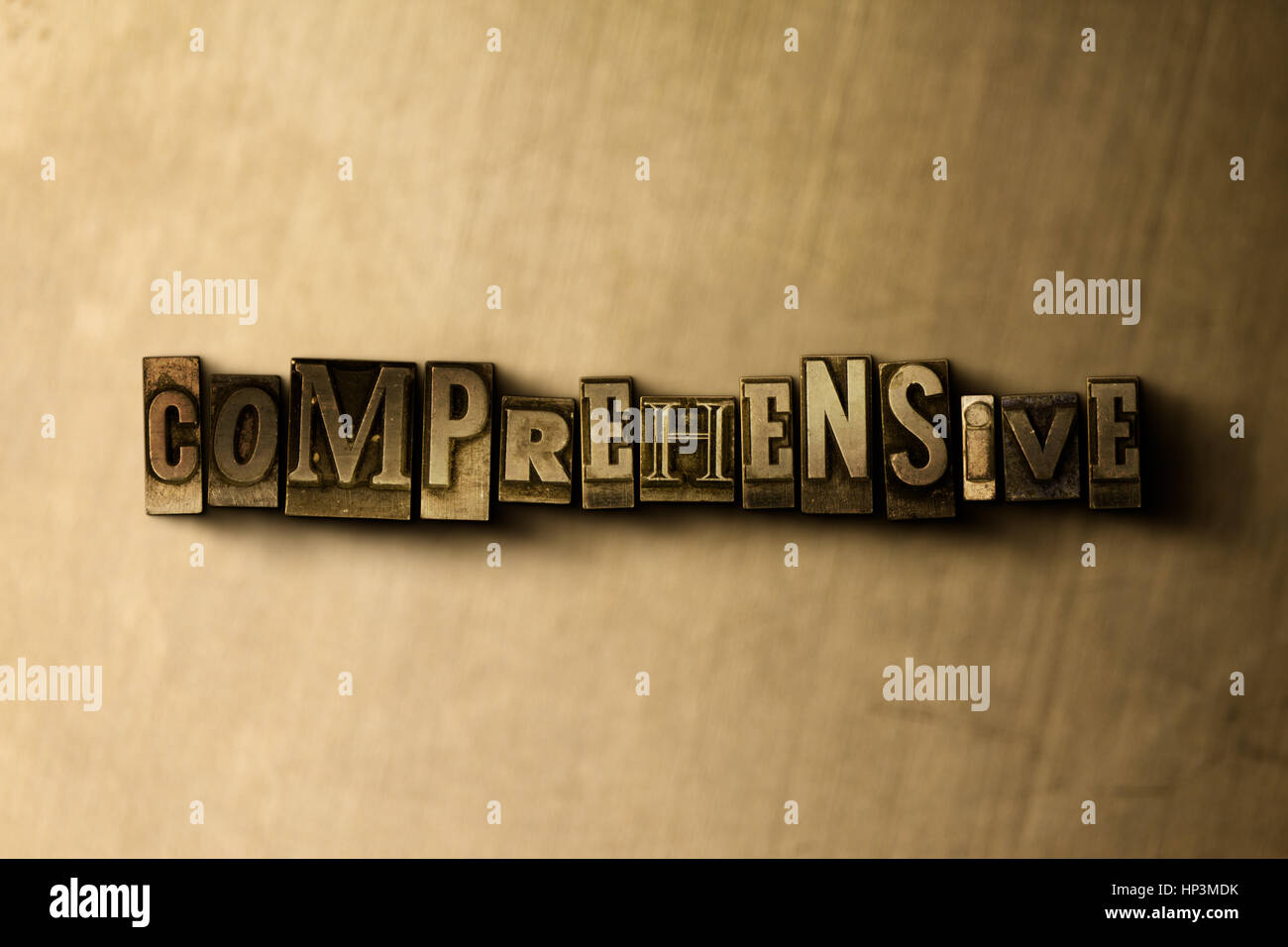 COMPREHENSIVE - close-up of grungy vintage typeset word on metal ...