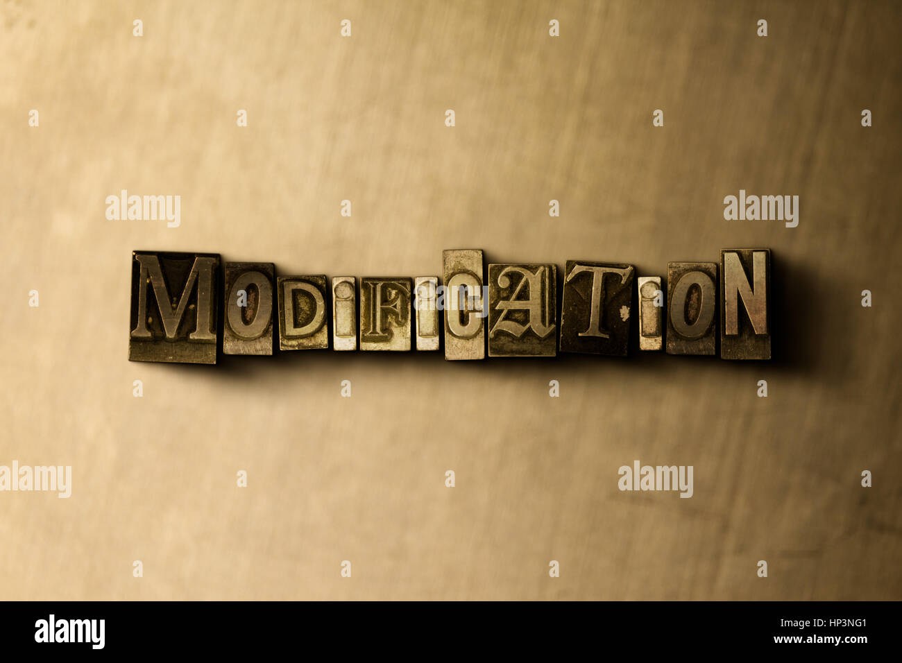 MODIFICATION - close-up of grungy vintage typeset word on metal ...